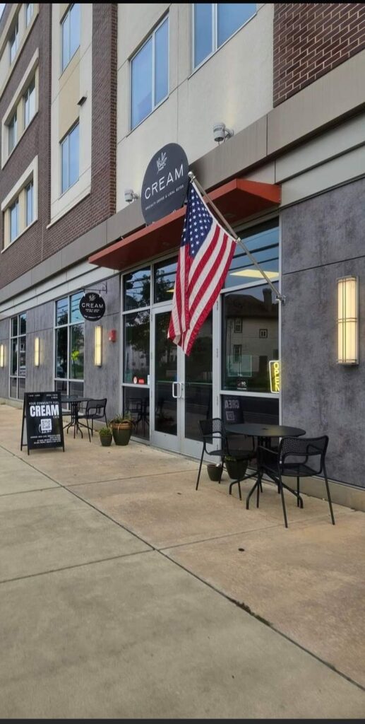 Cream cafe’ proudly flying the American flag. – American Flag Sighting